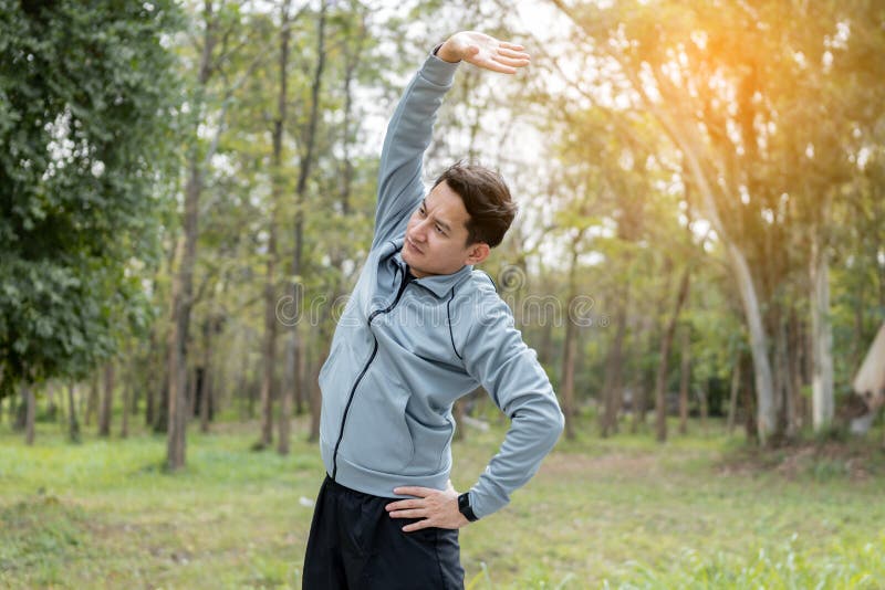 Male is Stretching Arm and Relaxing before Running in the Morning Stock ...