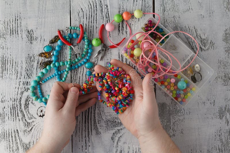Male Stringing Beads on the Needle Stock Image - Image of making ...
