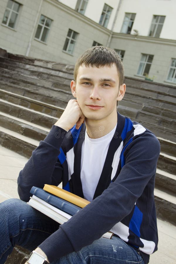 Male Student on Campus with Textbooks Stock Image - Image of indoor ...