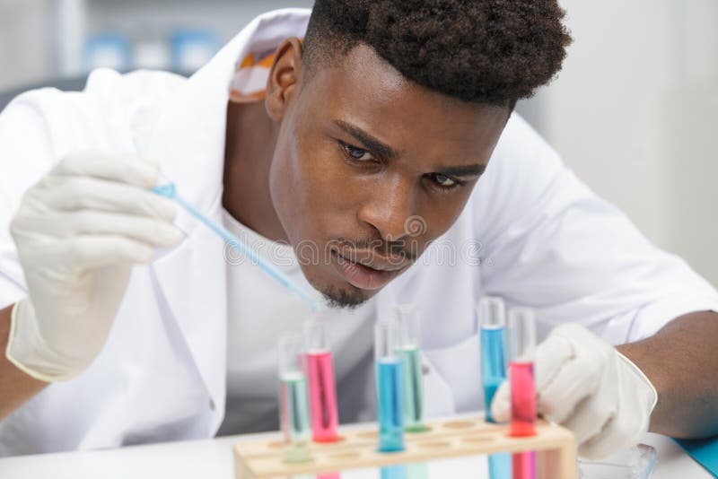 Male Student Chemistry Working in Laboratory Stock Image - Image of ...