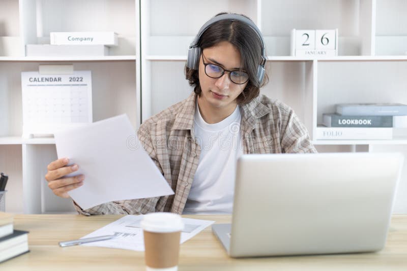 Male Student is Doing Homework Given by the Teacher through the Laptop ...