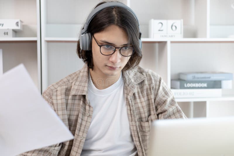 Male Student is Doing Homework Given by the Teacher through the Laptop ...