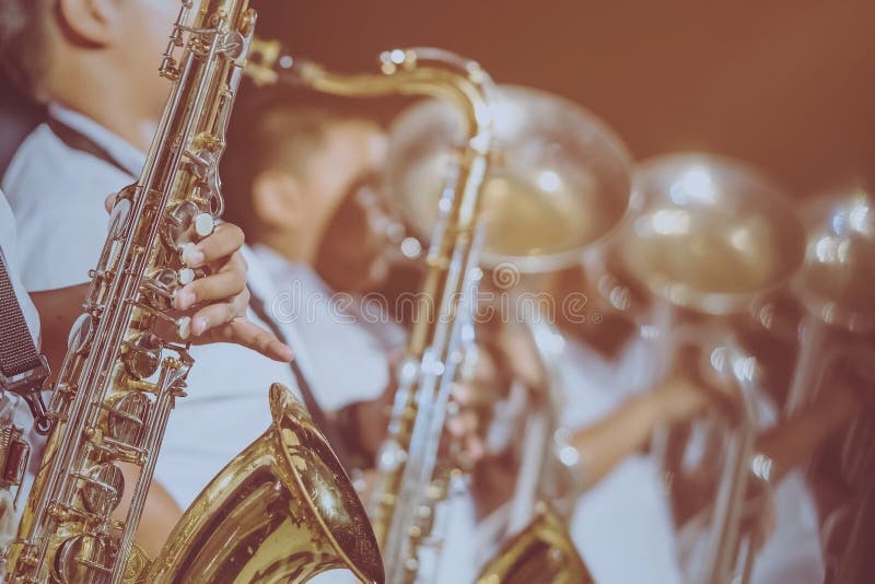 Male Student with Friends Blow the Saxophone with the Band for ...