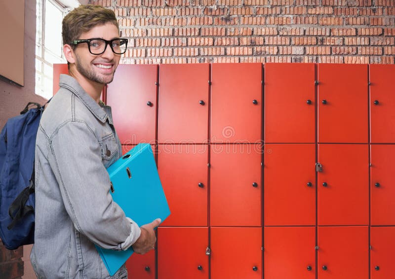 Male Student Holding Folder in Front of Lockers Stock Image - Image of ...