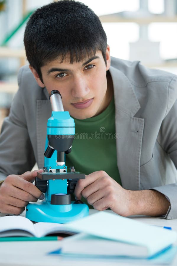 Male Student in Laboratory Working with Microscope Stock Photo - Image ... Male Student in Laboratory Working with Microscope Stock Photo - Image ...