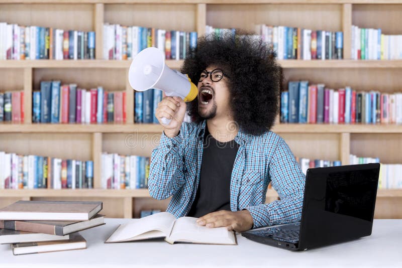 Male Student with Megaphone in the Library Stock Photo - Image of hair ...
