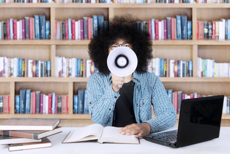 Male Student with a Megaphone in the Library Stock Photo - Image of ...