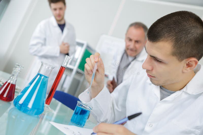 Male Student Performing Science Experiment Stock Photo - Image of flask ...