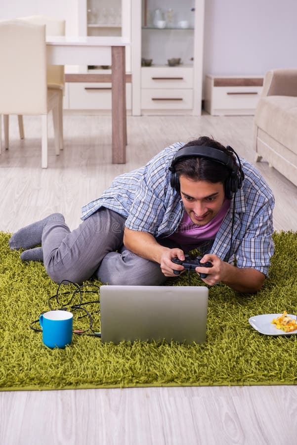 Young Male Student Playing Computer Games at Home Stock Photo - Image ...