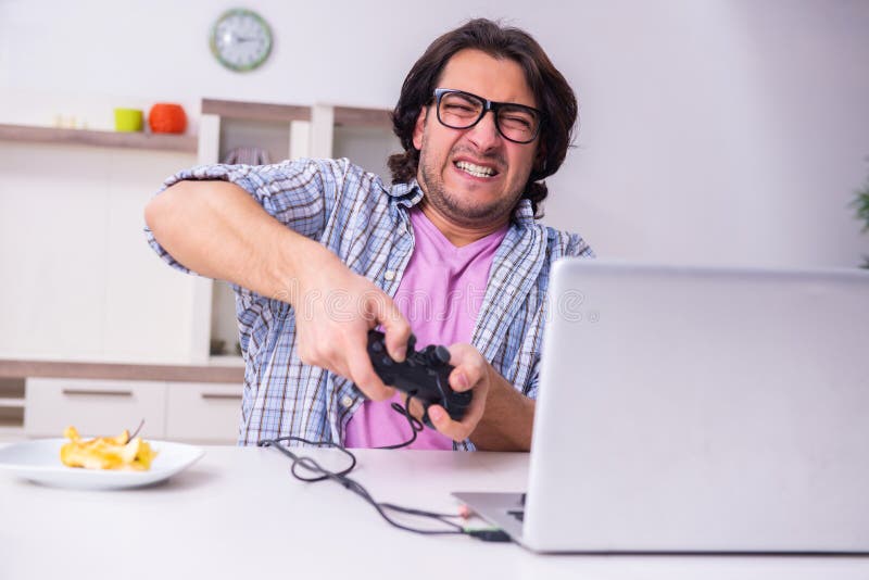 Young Male Student Playing Computer Games at Home Stock Image - Image ...