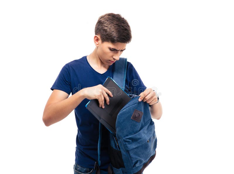 Male Student Putting Folder In Backpack Stock Image - Image: 55496817
