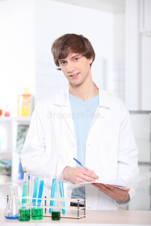 Student in a science lab stock image. Image of coat, inquire - 29880927