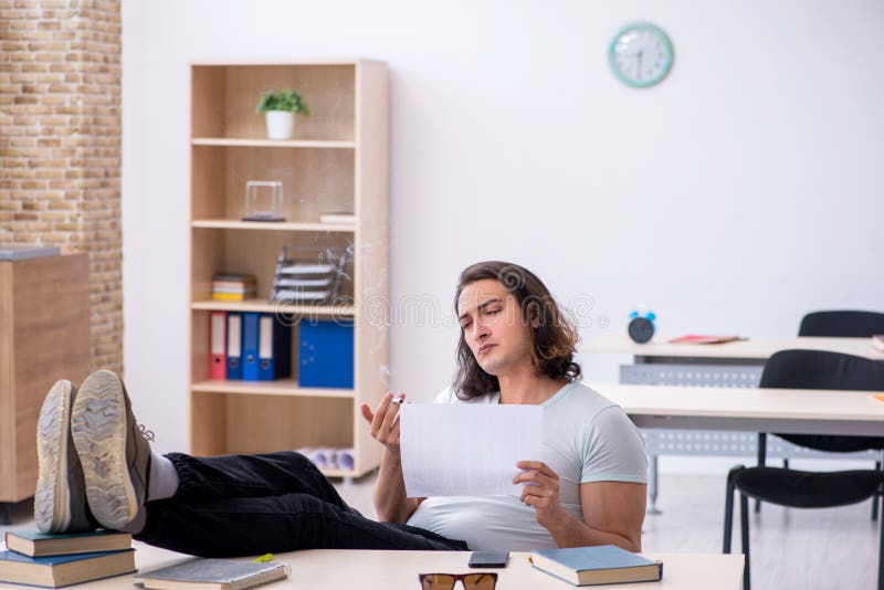 Young Male Student Smoking Cigarettes in the Classroom Stock Image ...