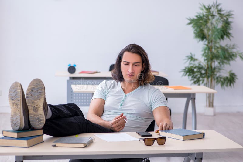 Young Male Student Smoking Cigarettes in the Classroom Stock Photo ...