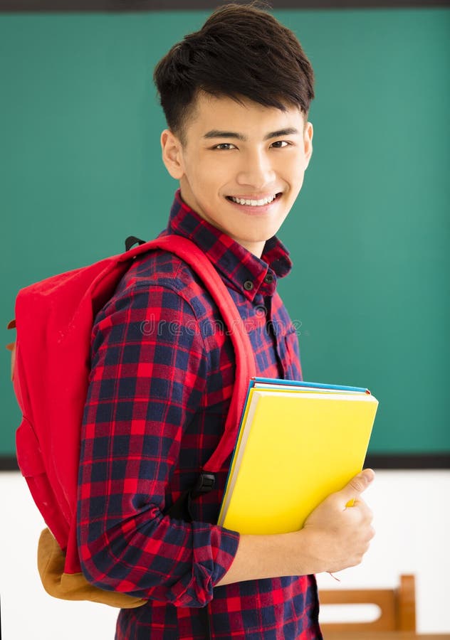 Male Student Standing in Classroom Stock Image - Image of handsome ...