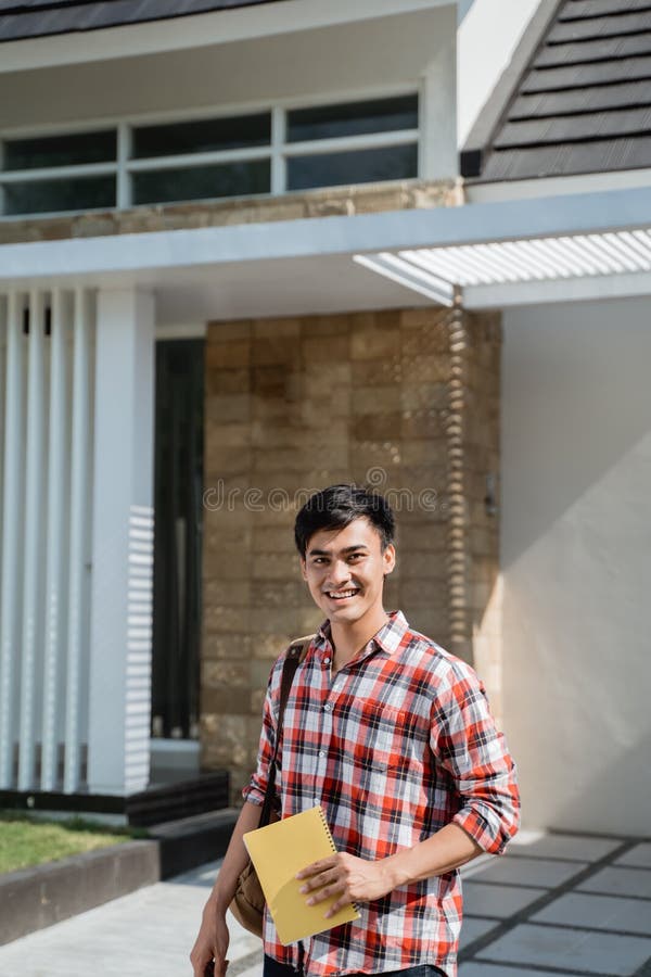 Male Student Standing in Front of His House Stock Image - Image of ...
