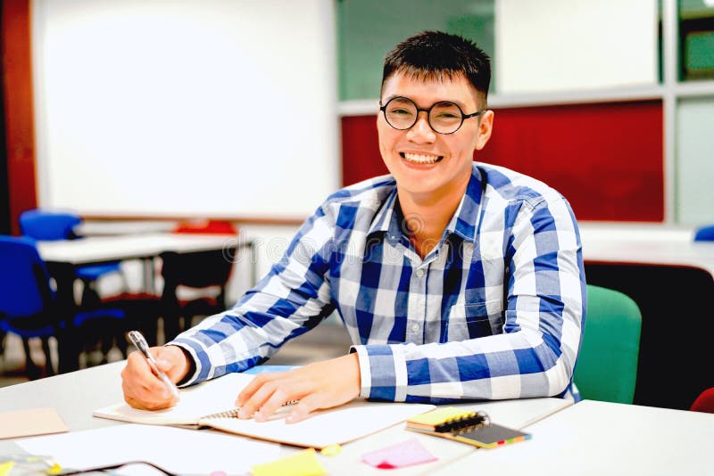 Male Student Study in the Campus | Smiling and Doing Homework Stock ...