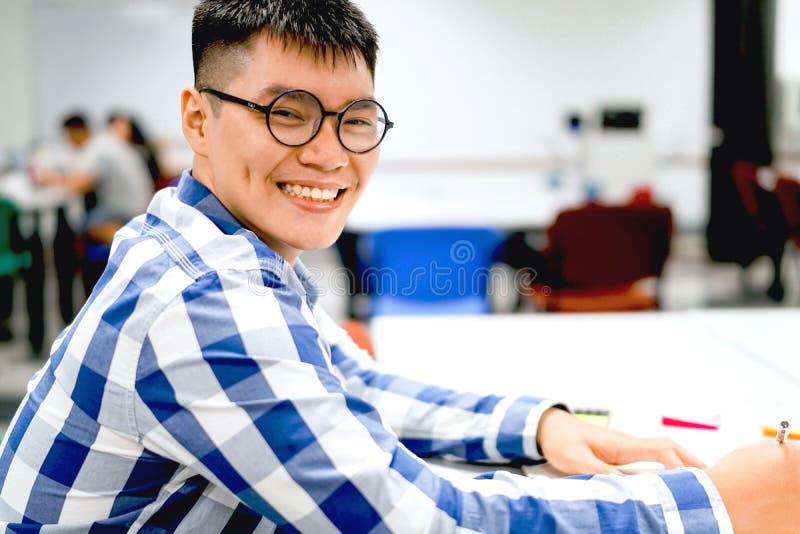 Male Student Study in the Campus | Smiling and Doing Homework Stock ...