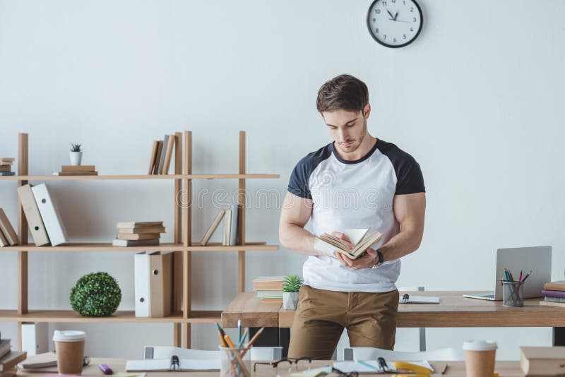 Male Student Studying with Book Stock Photo - Image of studying, people ...
