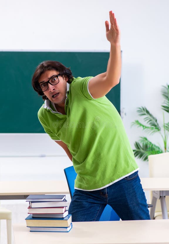 Male Student Suffering from Urge in the Classroom Stock Photo - Image ...