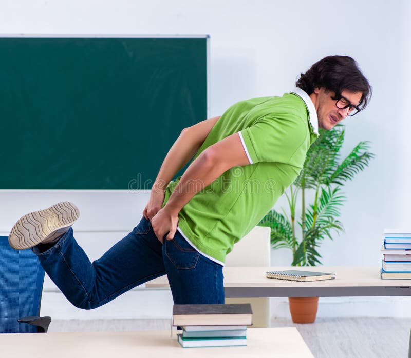Male Student Suffering from Urge in the Classroom Stock Image - Image ...