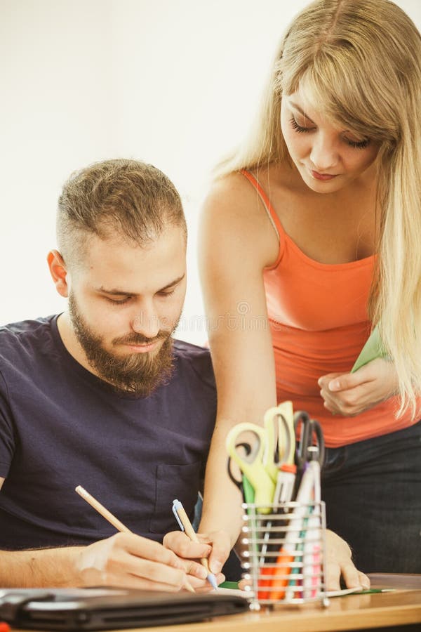 Tutor with Male Carpentry Student in Workshop Studying for College ...