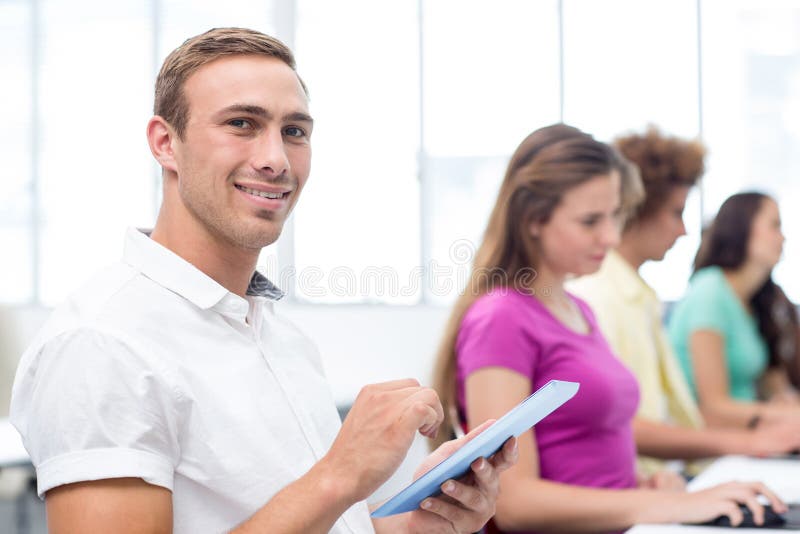 Male Student Using Digital Tablet in Computer Class Stock Photo - Image ...