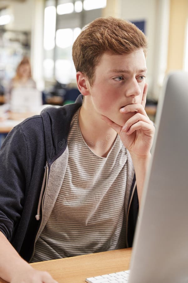 Male Student Working on Computer in College Library Stock Photo - Image ...