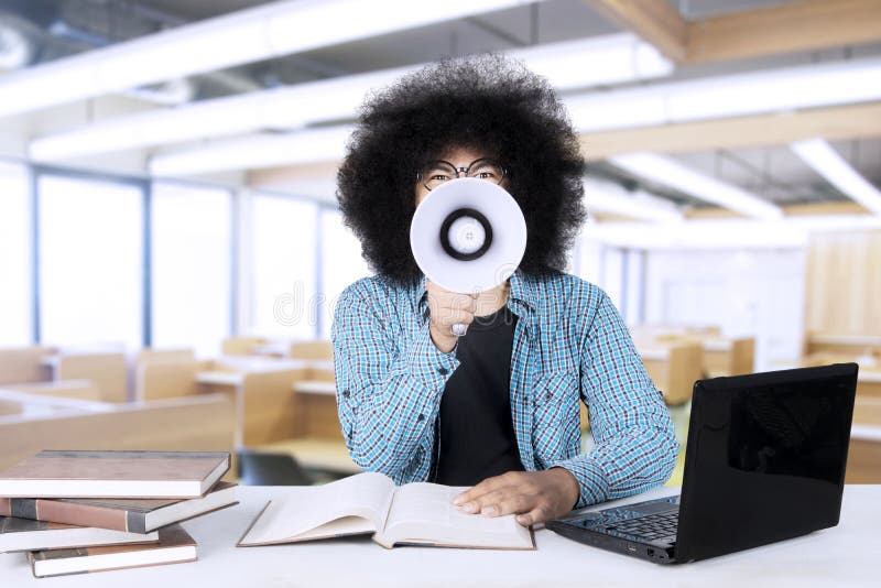 Male Student Yelling with a Megaphone Stock Photo - Image of laptop ...
