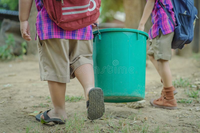 Male Students Help To Remove Rubbish from the Classroom To Pile Waste ...