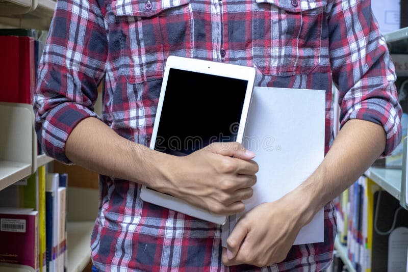 Male Students Use Technology To Find Books To Read in the Library ...