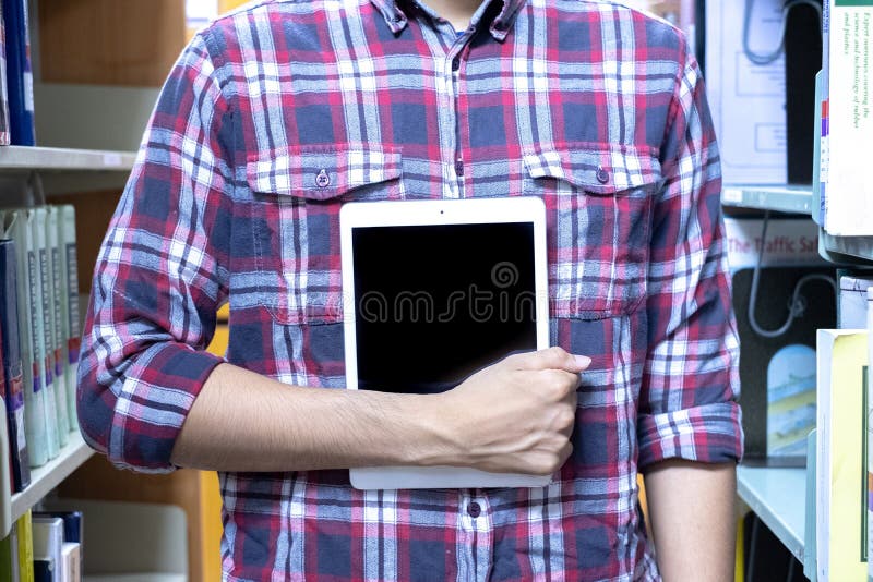 Male Students Use Technology To Find Books To Read in the Library ...