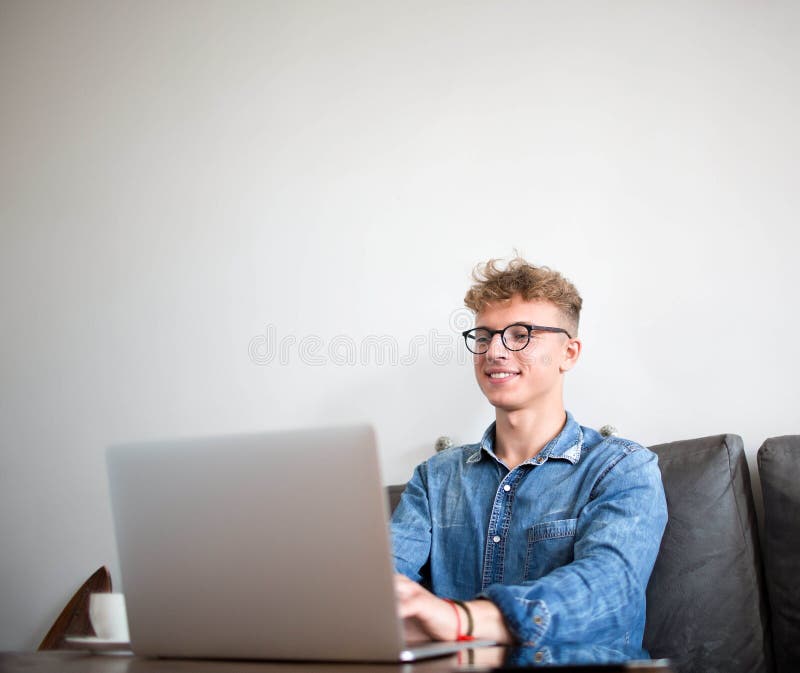 Young Smiling Man Experience Web Content Writer Using Laptop Computer ...