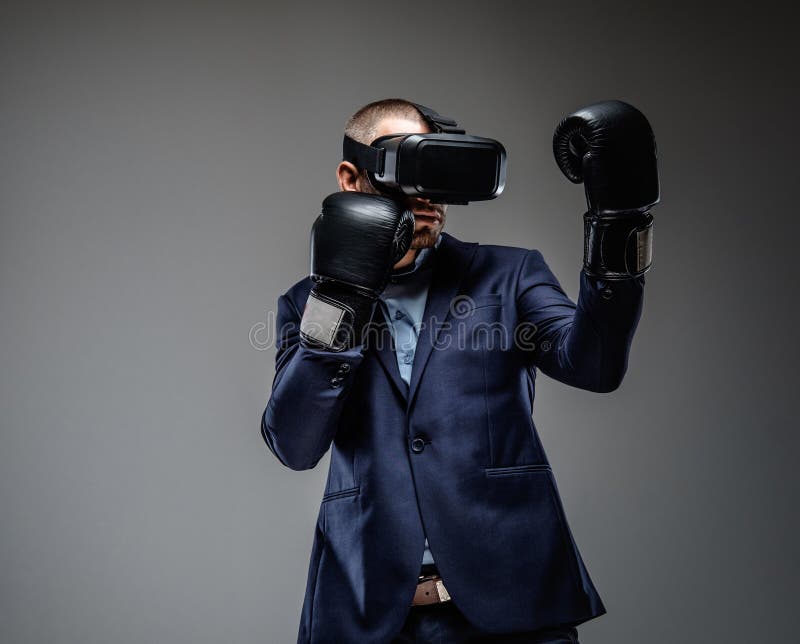 Male in a Suit Fighting with Virtual Reality Glasses on His Head Stock ...