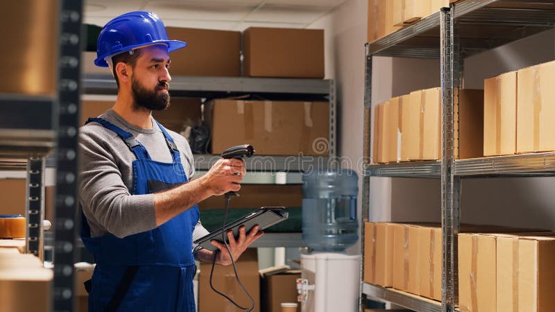 Male Supervisor Scanning Barcodes on Packages in Depot Stock Photo ...