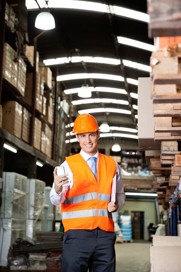 Male Supervisor Using Cell Phone at Warehouse Stock Image - Image of ...