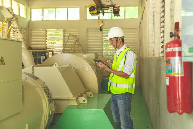 Male Superyacht Engineer Working on the Engine Room, Inspecting the ...