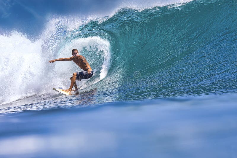 Male surfer on a blue wave stock photo. Image of active - 367087332