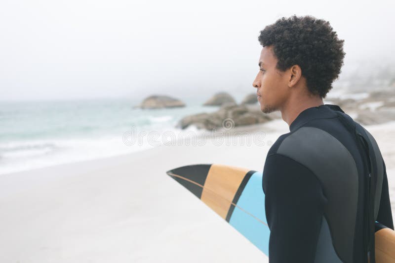 Male Surfer Holding Surfboard on the Beach Stock Image - Image of ...