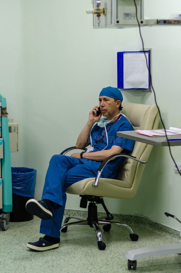 Male Surgical Doctor Talking on the Phone Stock Photo - Image of ...