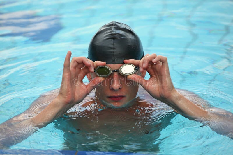 Male Swimmer Adjusting Goggles Stock Photo - Image of fixing, energy ...