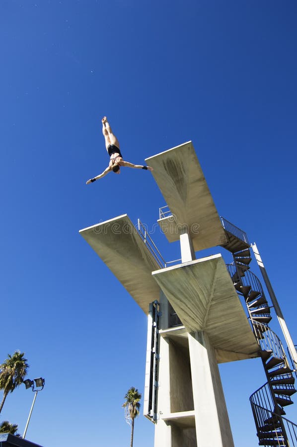 Male Swimmer Diving from Springboard Stock Photo - Image of outdoors ...