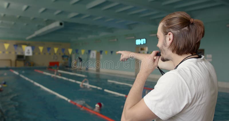 Coach Practise With Swimmer In The Indoor Swimming Pool Stock Footage