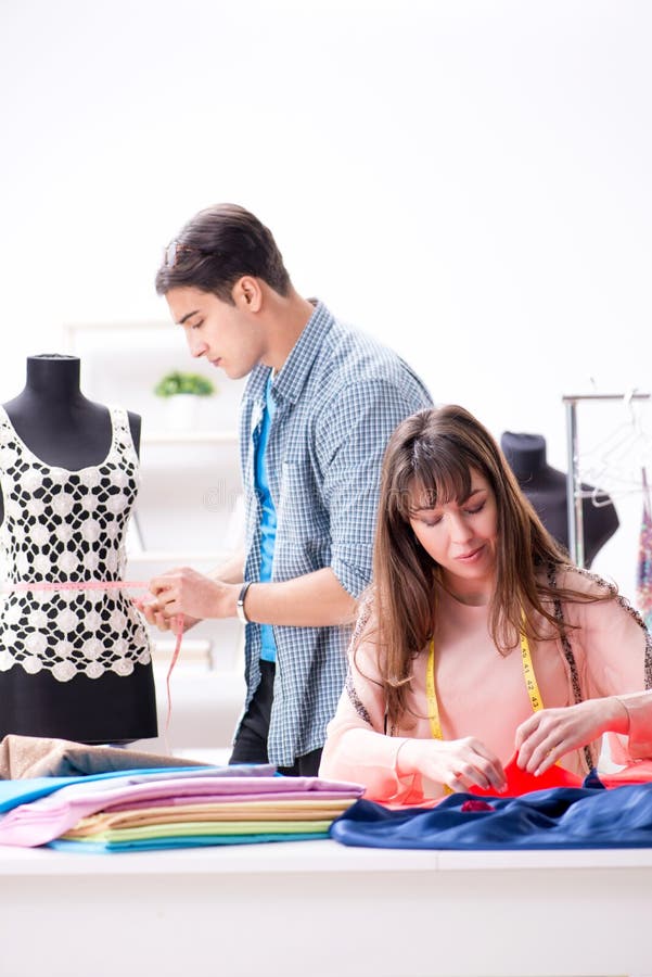 The Male Tailor with Female Student in Workshop Stock Image - Image of ...