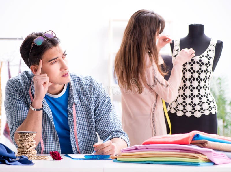 Male Tailor with Female Student in Workshop Stock Photo - Image of ...