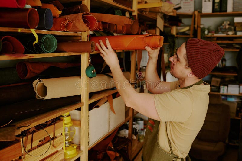 Male Tailor Choosing Leather Roll Stock Photo - Image of production ...