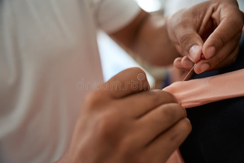 Male Tailor Using Needle for Making Pink Dress Stock Photo - Image of ...