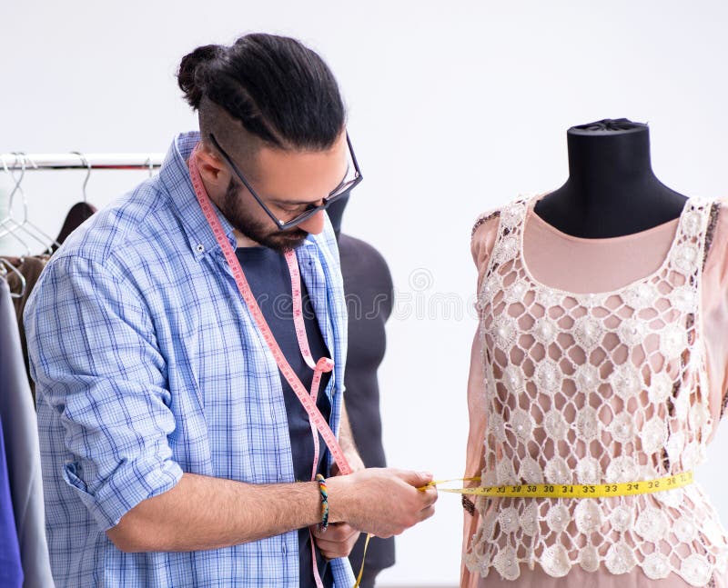 Male Tailor Working in the Workshop on New Designs Stock Photo - Image ...