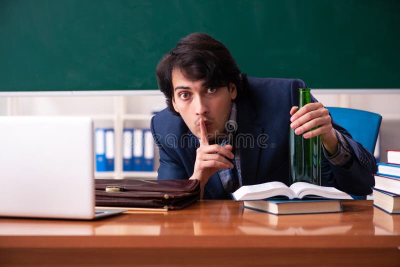 The Male Teacher Drinking in the Classroom Stock Photo - Image of drink ...
