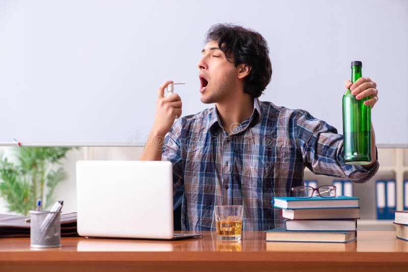 The Male Teacher Drinking in the Classroom Stock Image - Image of board ...